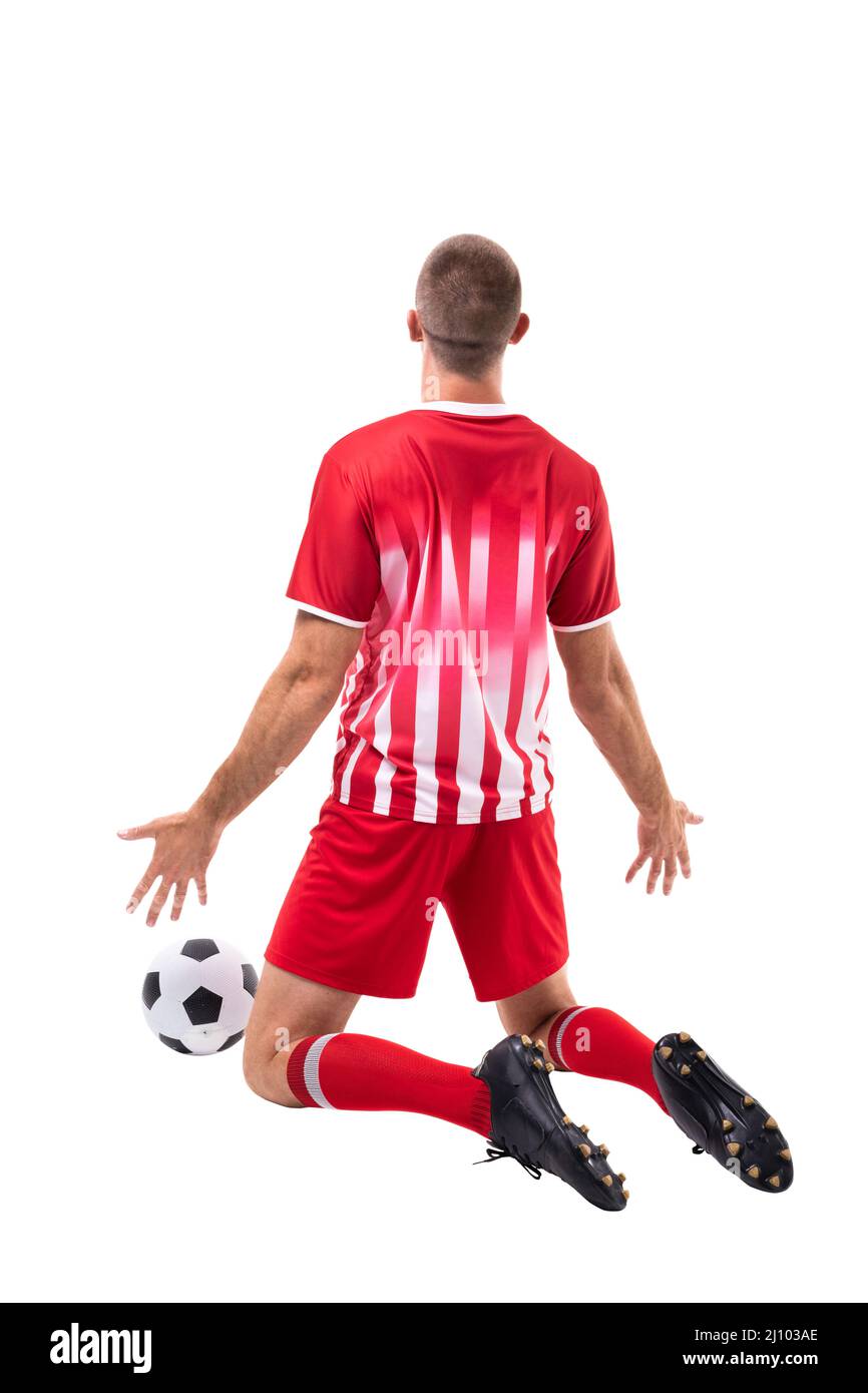 Rear view of male caucasian player celebrating goal by soccer ball over ...