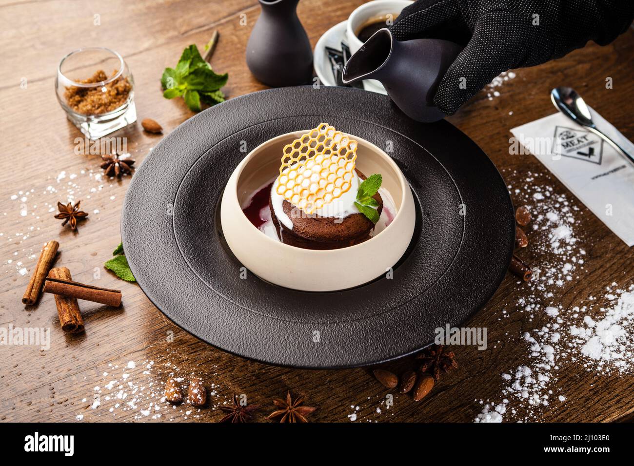 Chocolate fondant. Dark chocolate, raspberry sauce, vanilla ice cream ...