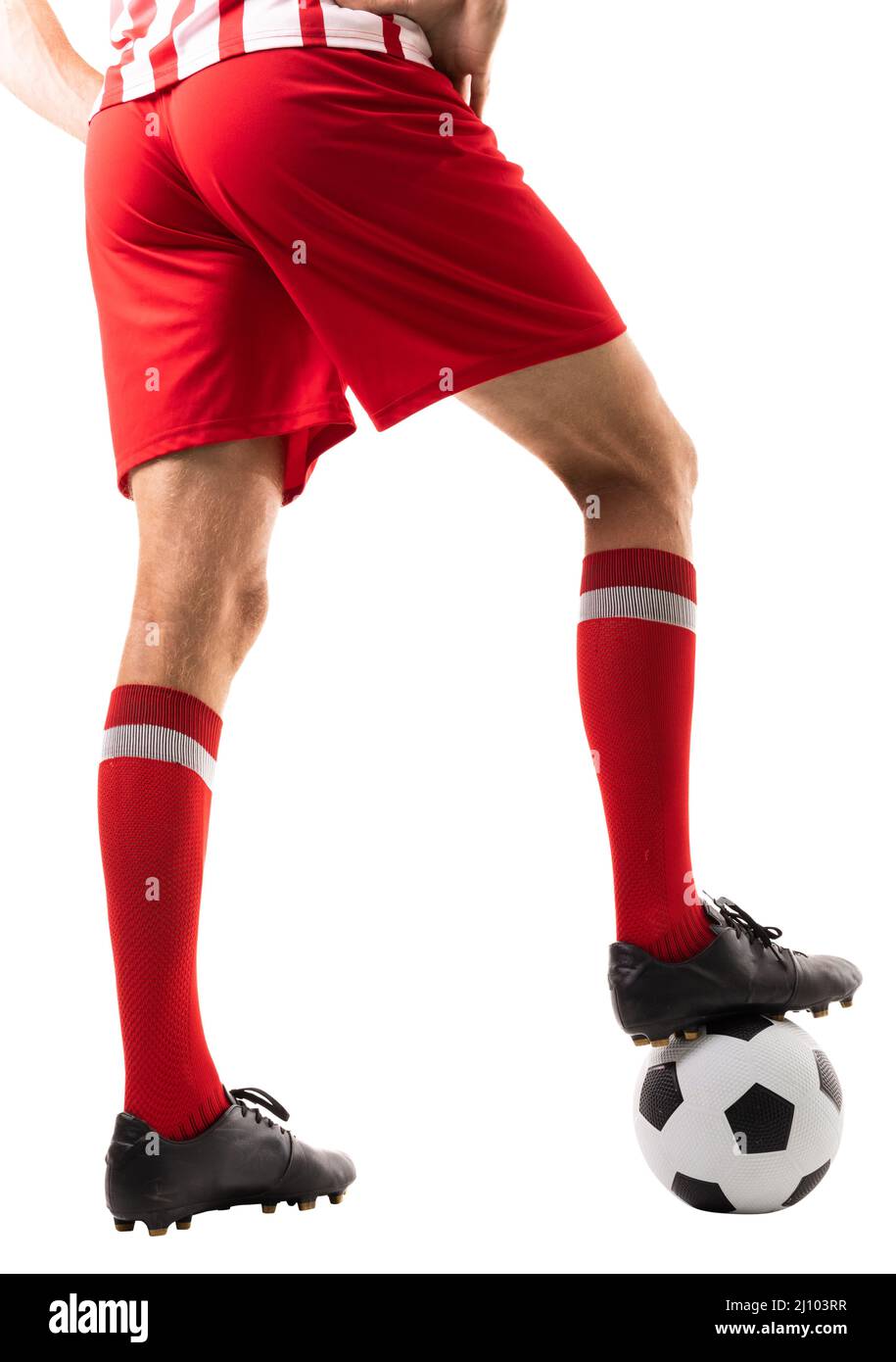 Low section of male caucasian athlete stepping on soccer ball over ...