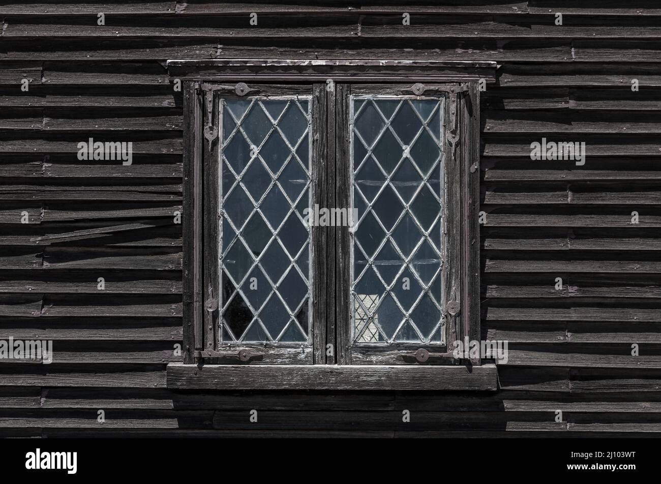 Rustic windows with wood board siding Stock Photo - Alamy