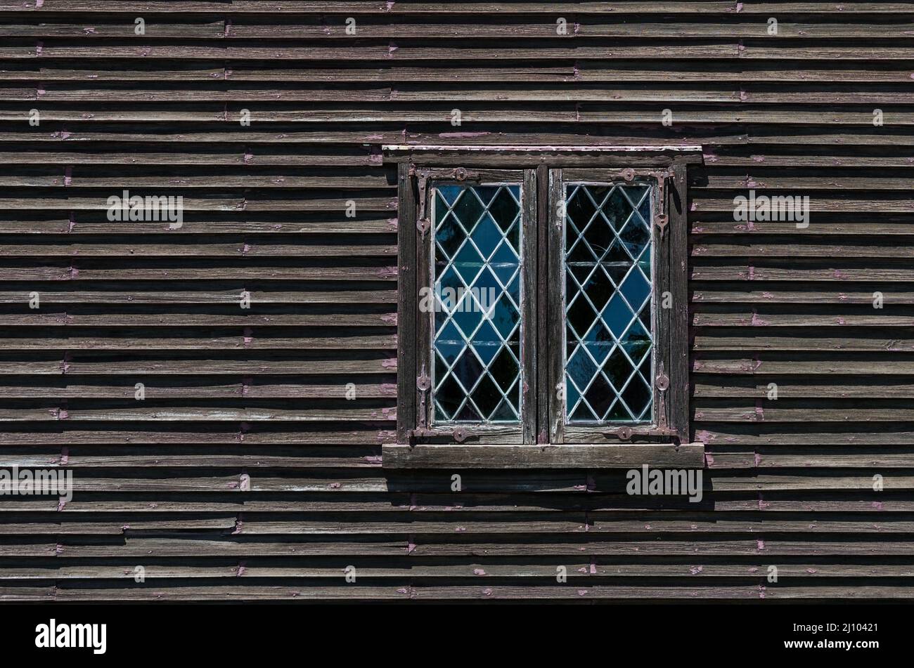 Rustic window on wood board siding Stock Photo - Alamy