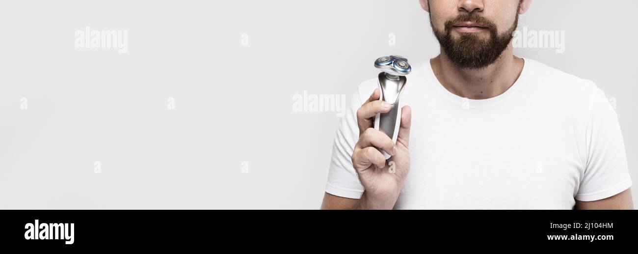 Man and shaver hi-res stock photography and images - Alamy