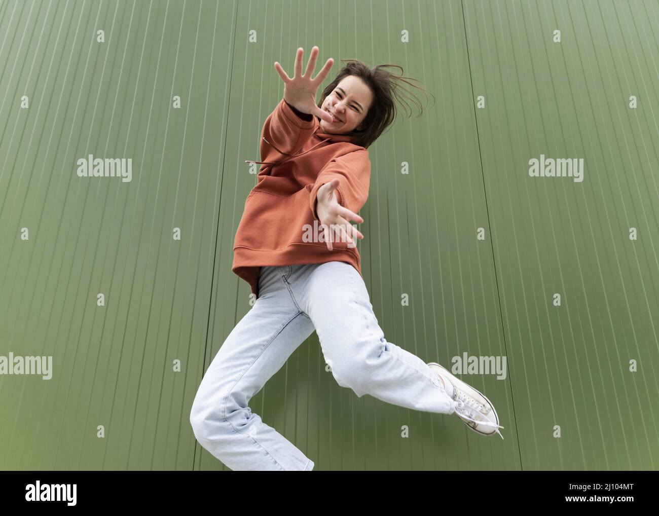 Portrait young beautiful female jumping 3 Stock Photo - Alamy