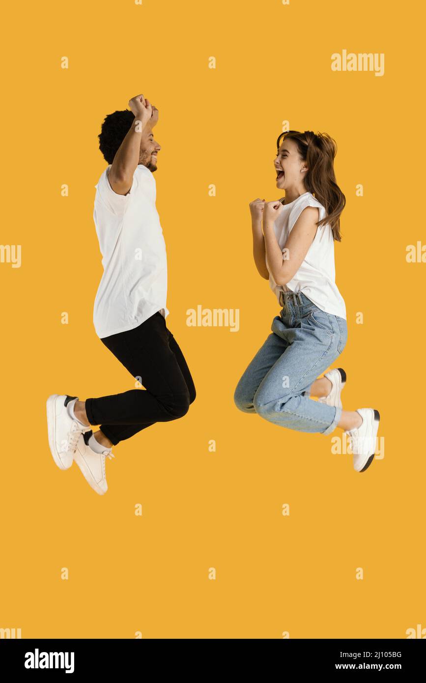 Pretty brunette jumping up hi-res stock photography and images - Alamy