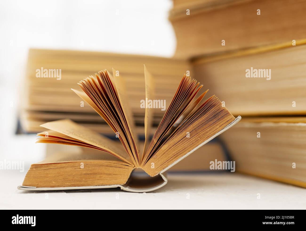 Open book table Stock Photo - Alamy
