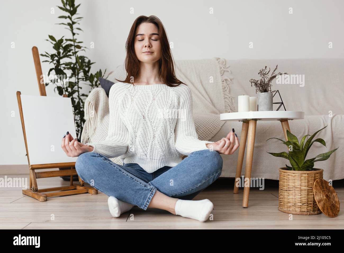 Female meditating indoor portrait Stock Photo - Alamy