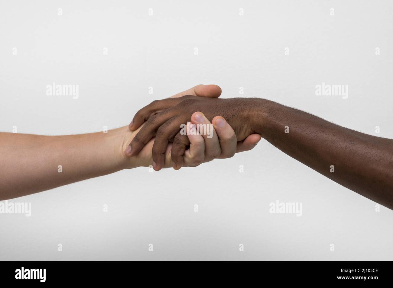 Multiracial hands coming together Stock Photo - Alamy