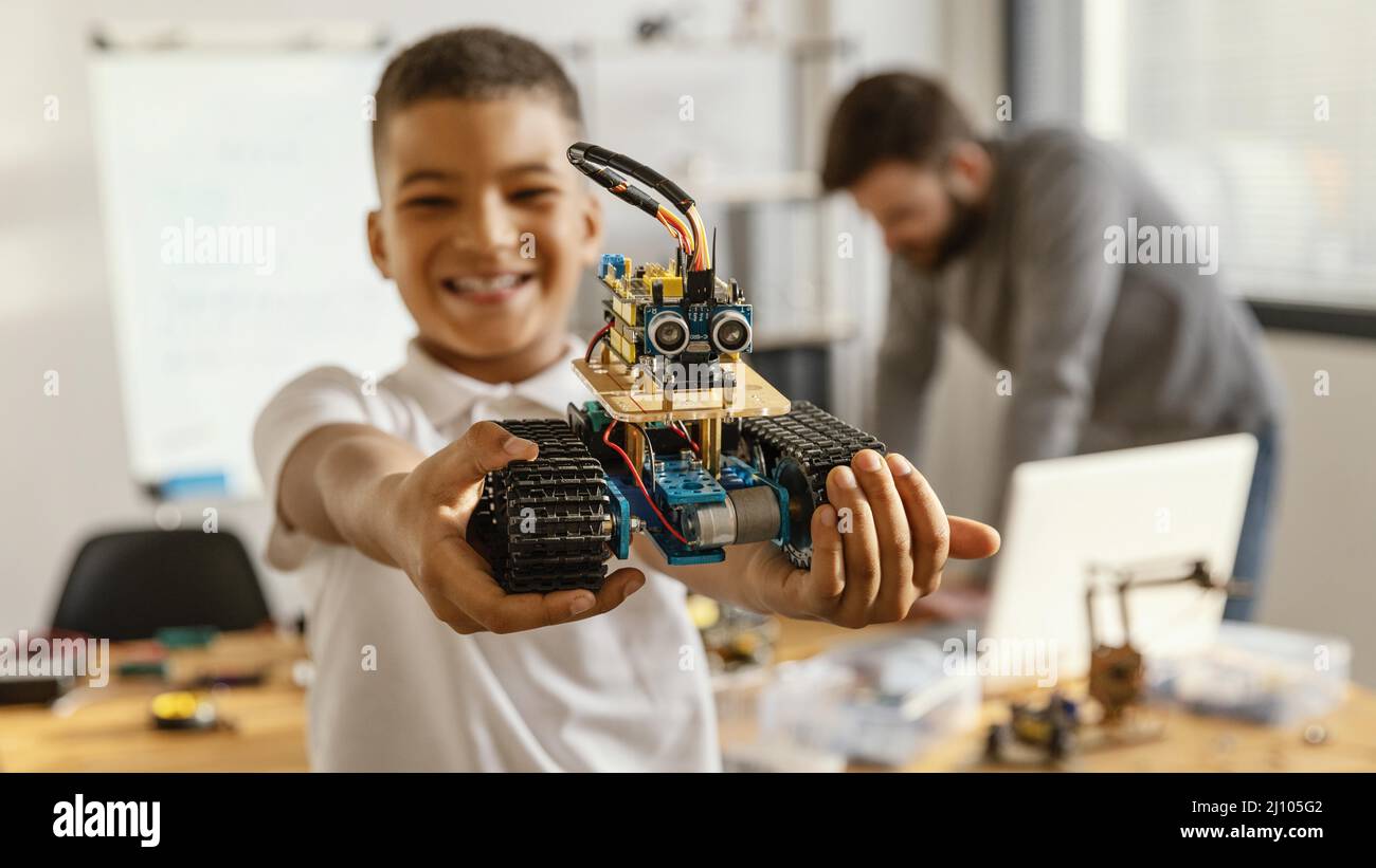 Father son making robot Stock Photo - Alamy