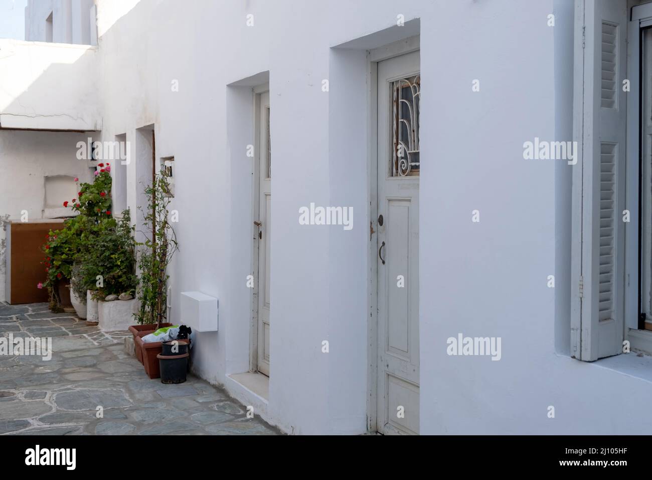 Greek Island, Cyclades. Grey wooden close vintage door, window with ...