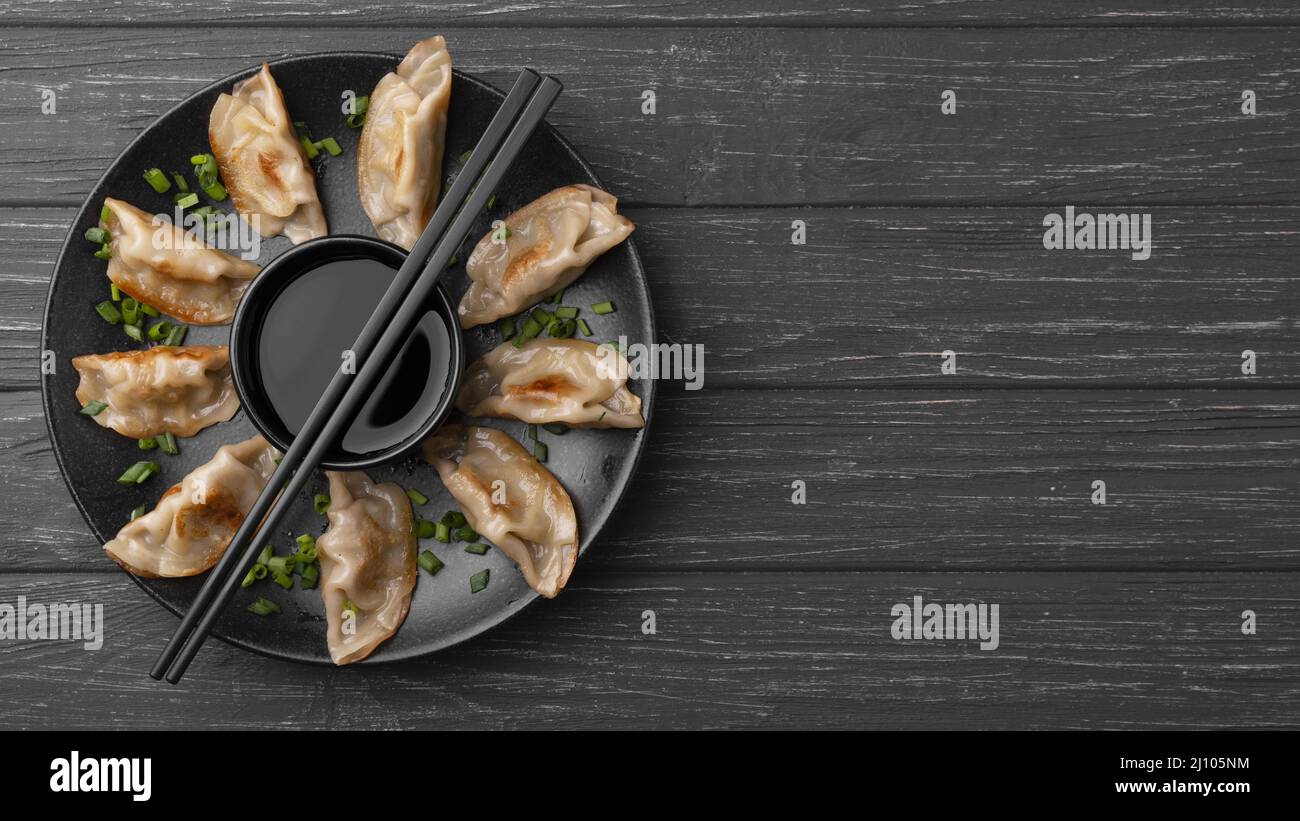 Traditional dumplings plate with chopsticks Stock Photo - Alamy