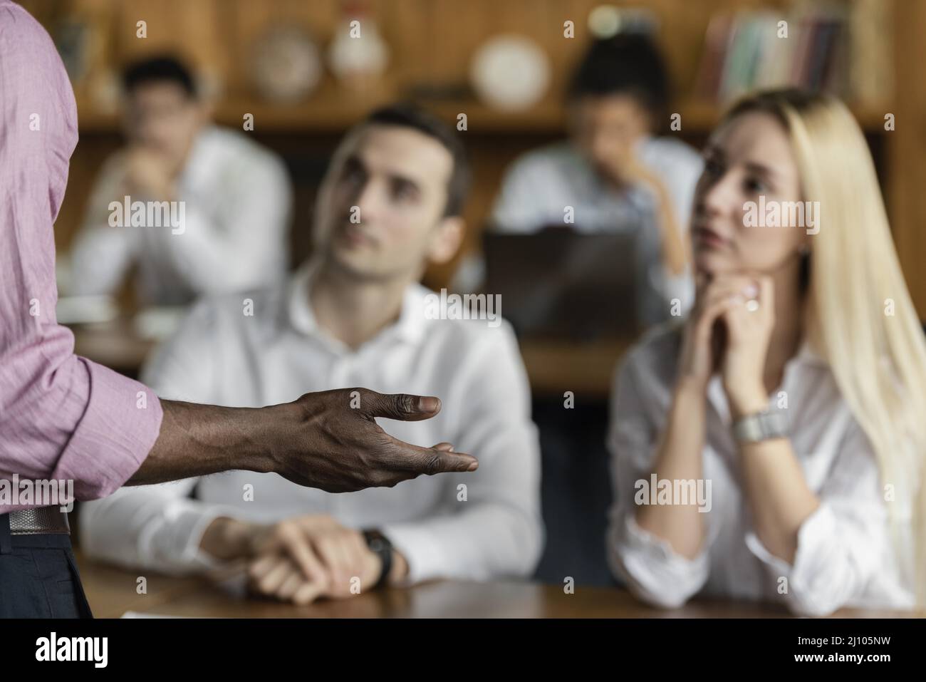 People listening watching man holding presentation work Stock Photo - Alamy