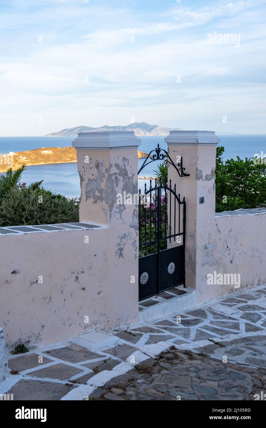 Greek Island, Cyclades. House fence, entrance gate closed, whitewashed ...