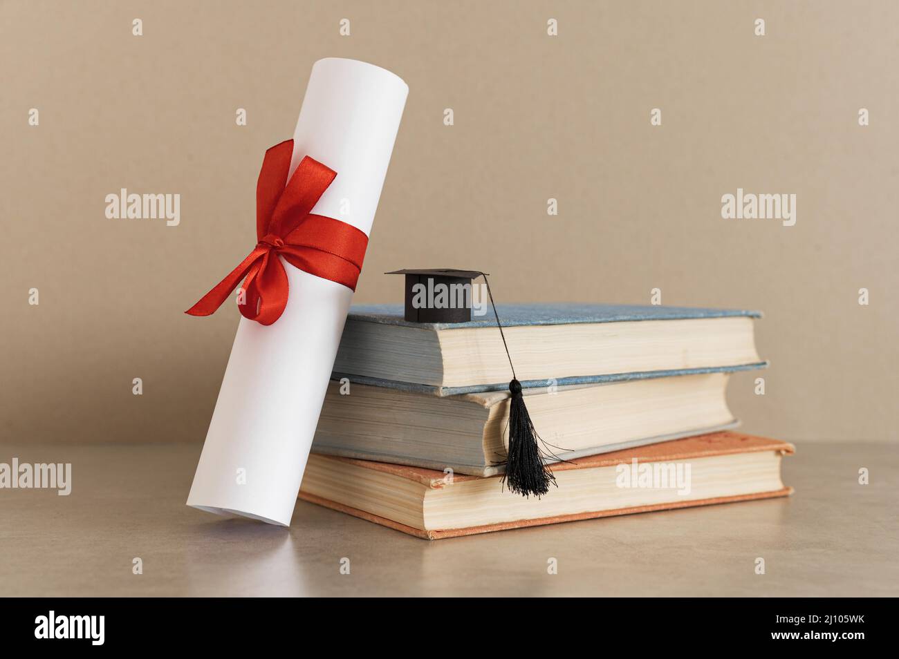 Education diploma certificate small graduation hat Stock Photo - Alamy