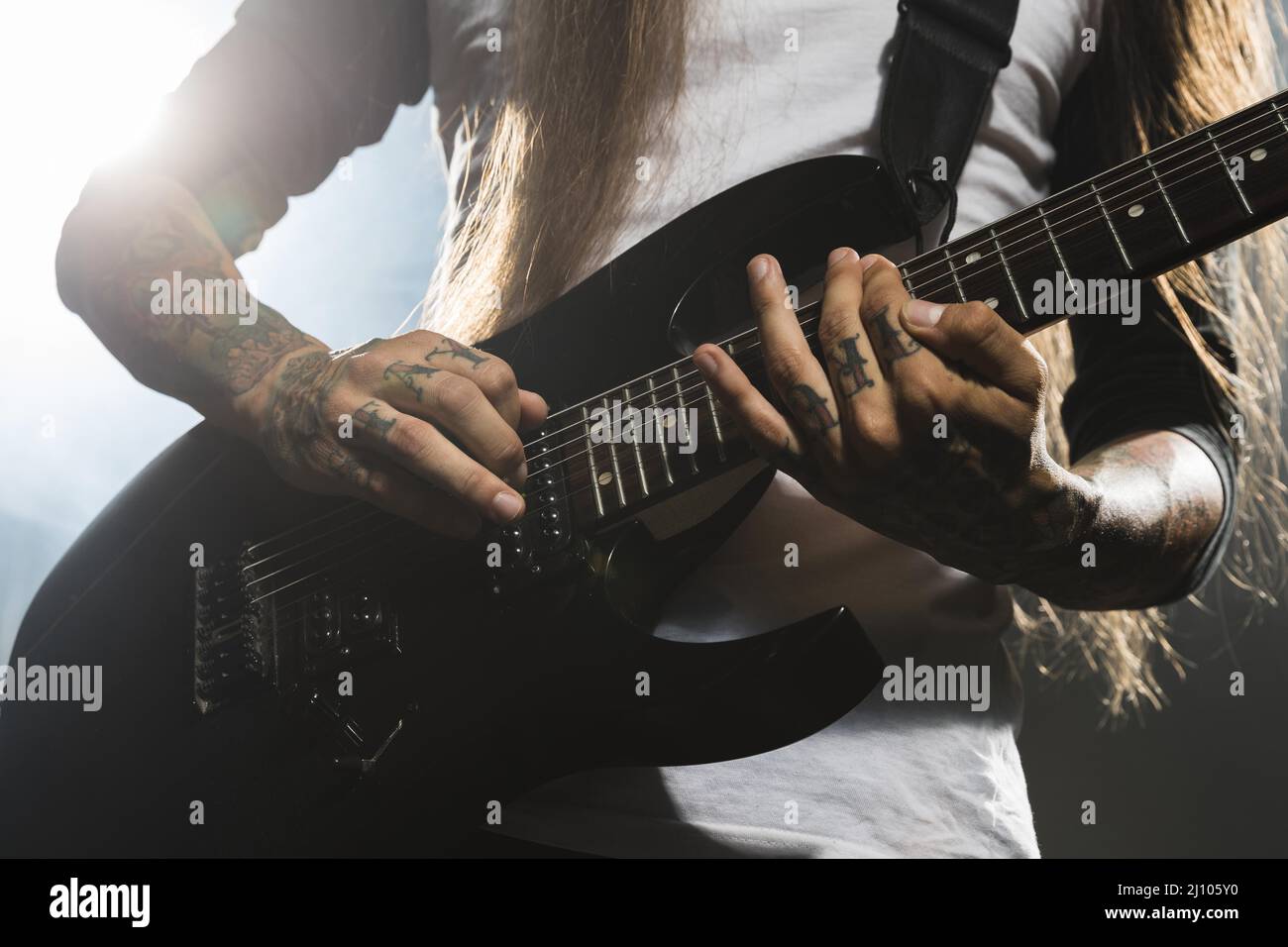 Artist playing electric guitar Stock Photo - Alamy