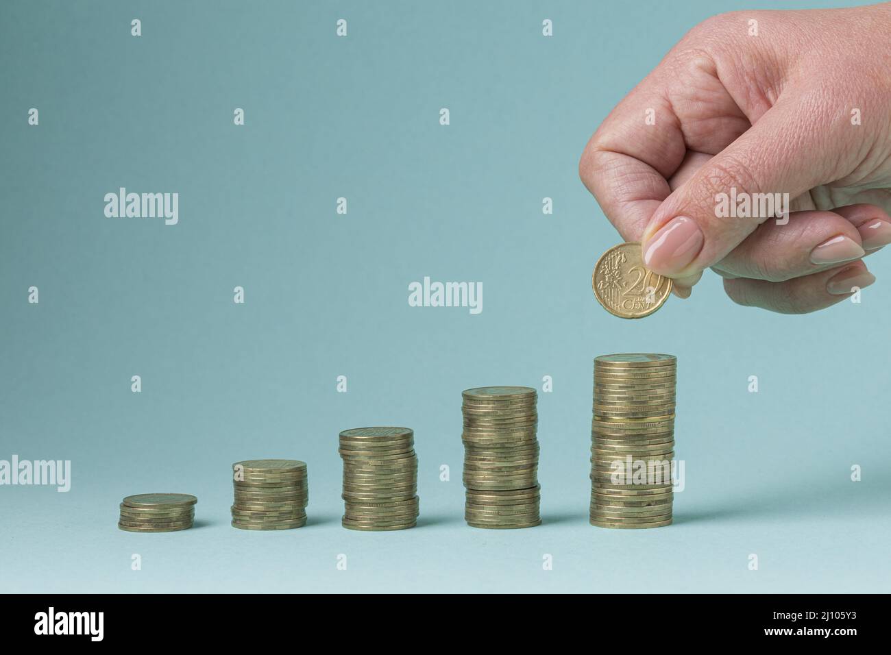 Pile coins forming graph Stock Photo - Alamy