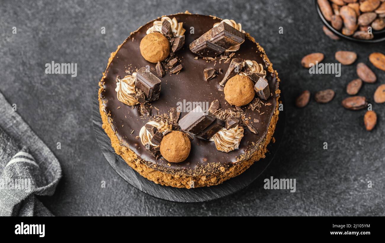 Flat lay delicious chocolate cake stand Stock Photo - Alamy