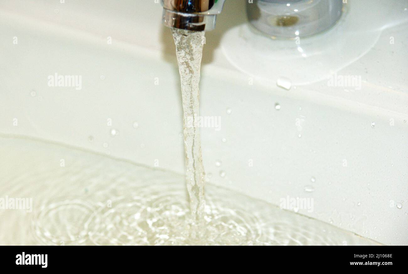 Faucet with water jet in a private sink Stock Photo - Alamy