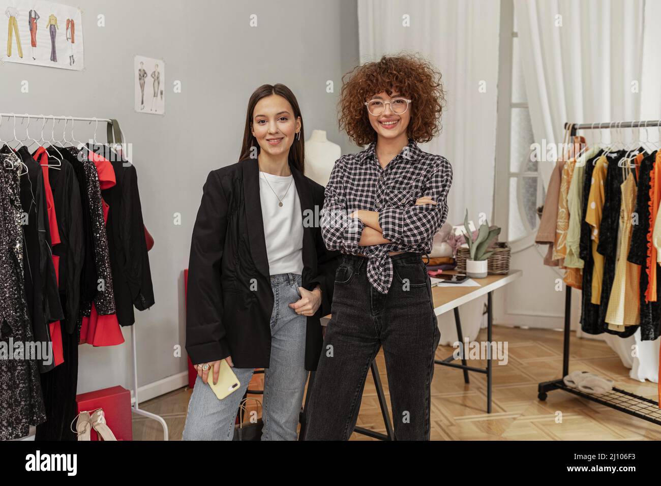 Clothes store employees working Stock Photo - Alamy