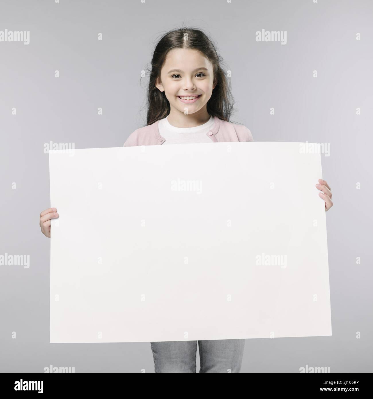 Girl with empty poster studio Stock Photo - Alamy