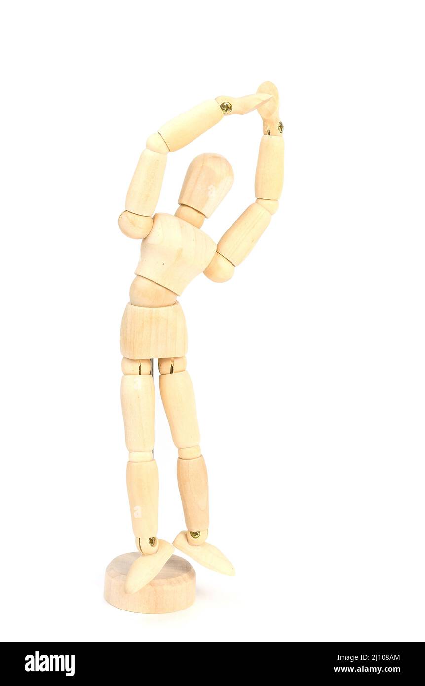 Wooden mannequin man doing stretching exercise on white background ...