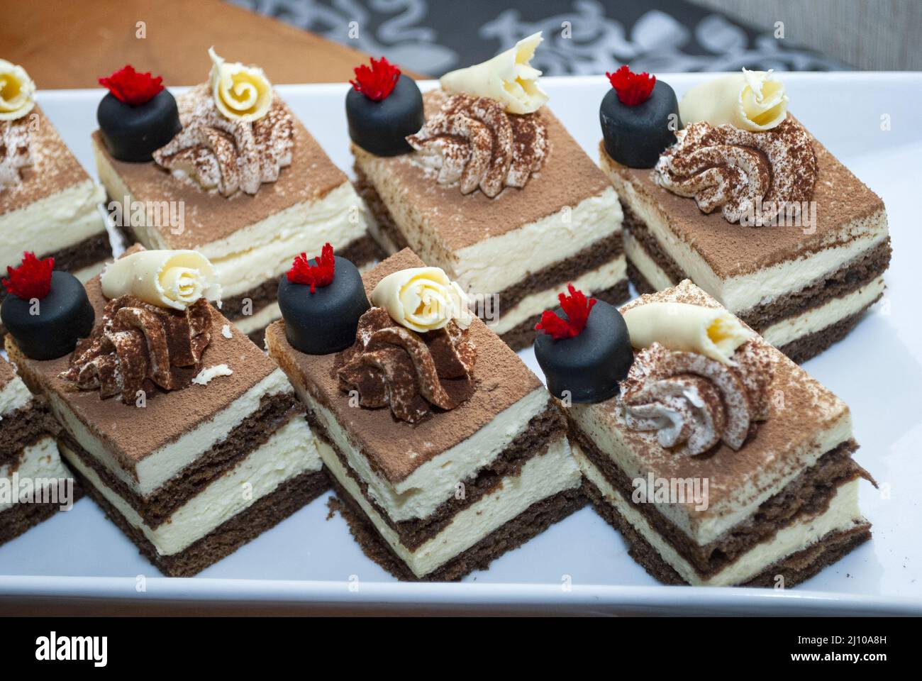 Portions of cake served on plates for graduation party, dessert in ...