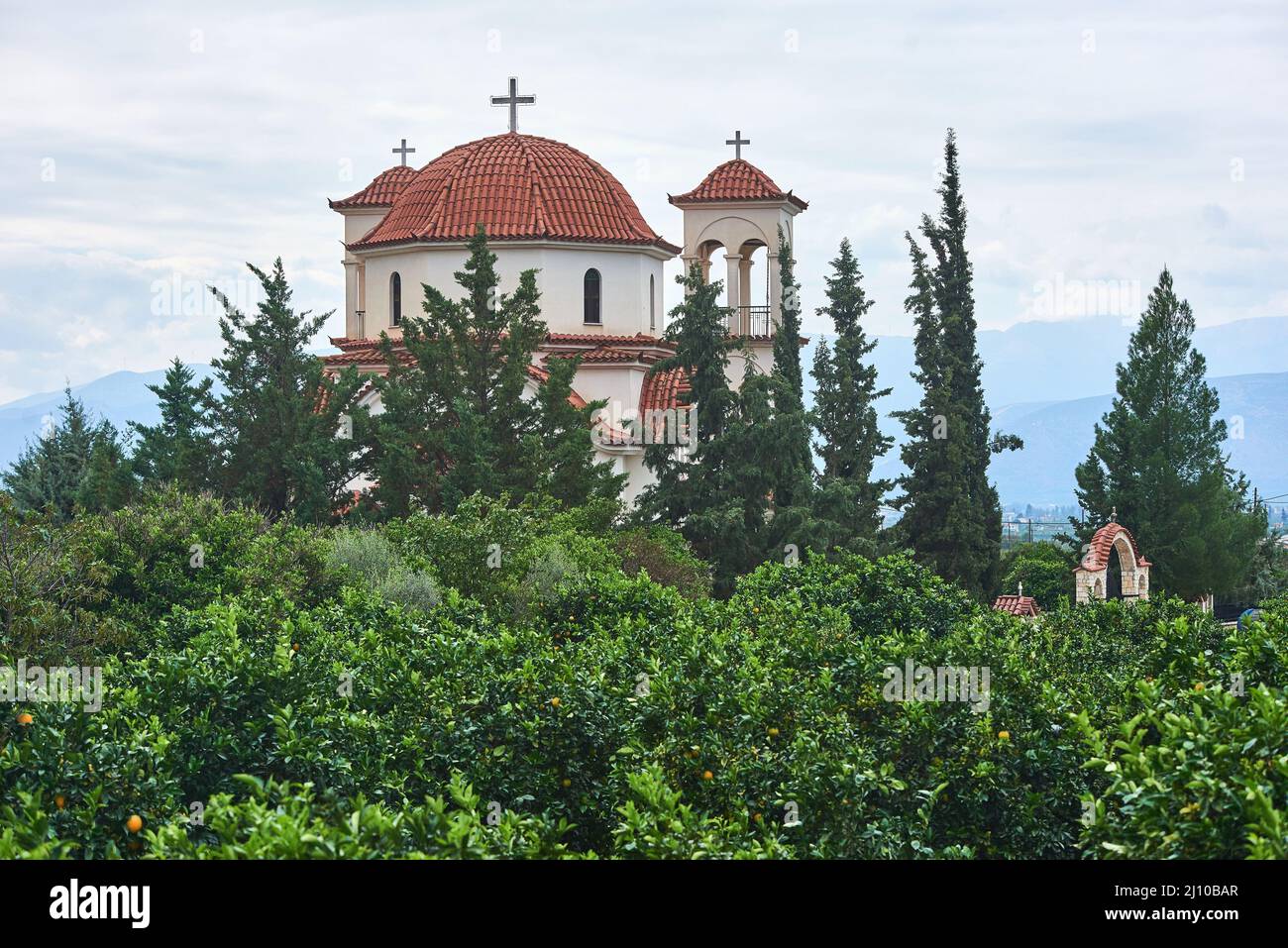 Church behind the trees in Greece Stock Photo - Alamy