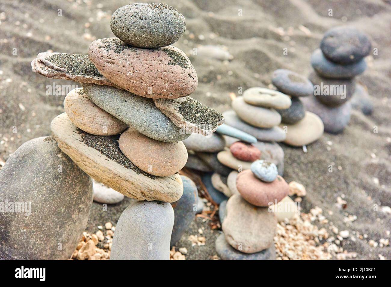 Closeup shot of small pebbles stacked in balance at the beach Stock ...