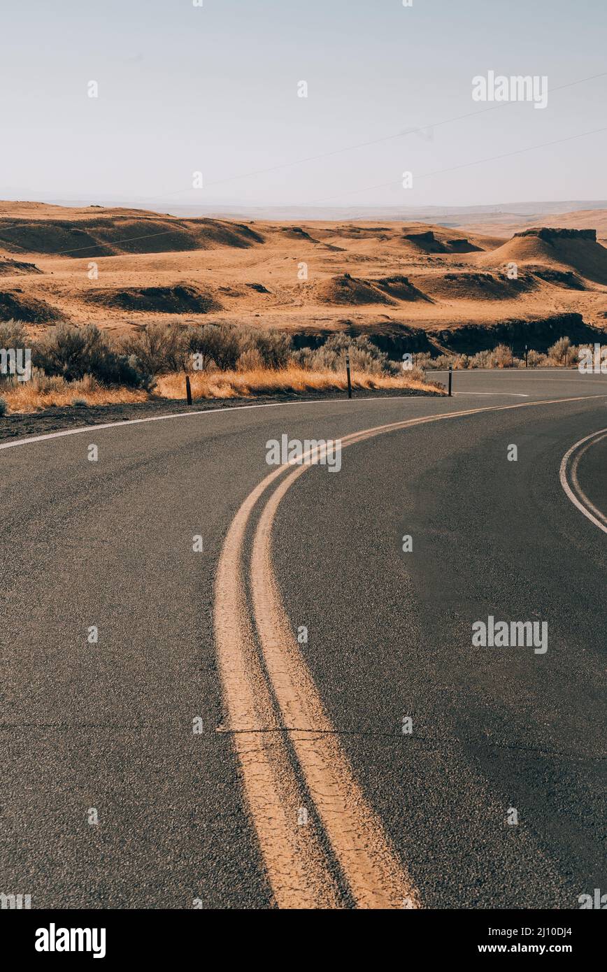 Vertical shot of a clean and empty asphalt travel road Stock Photo - Alamy
