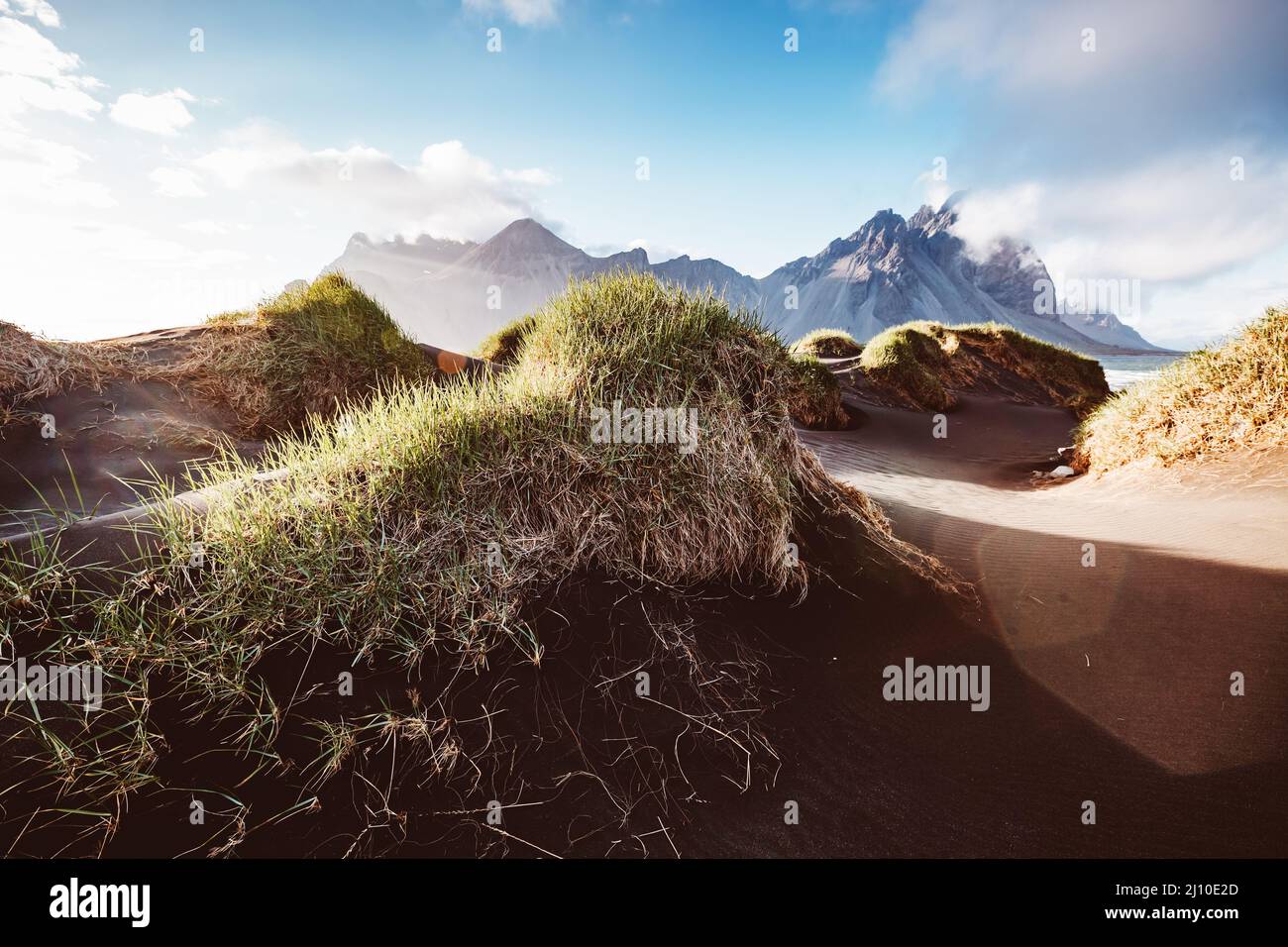 Unusual hills glowing by sunlight. Dramatic and gorgeous scene. Tourist ...