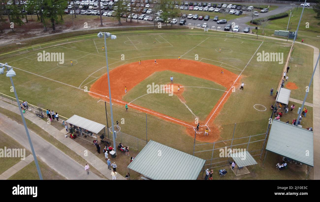 High-angle shot of baseball field and the surrounding areas with people ...