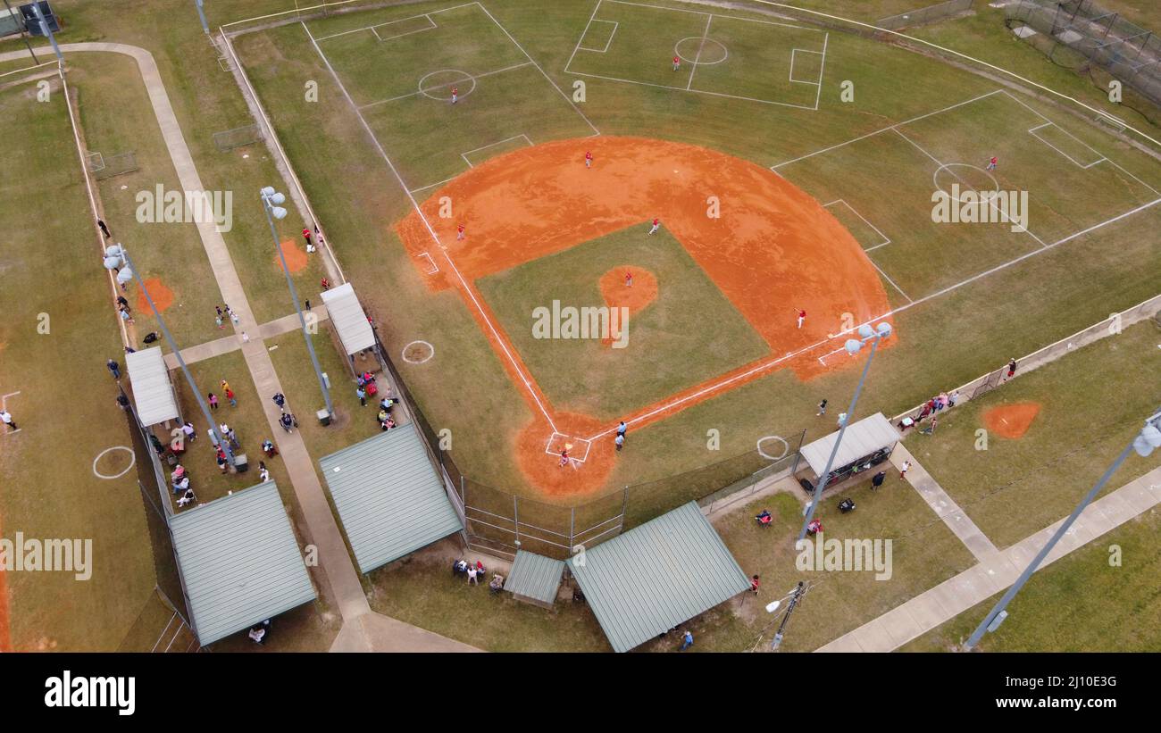 High-angle shot of baseball field and the surrounding areas with people ...