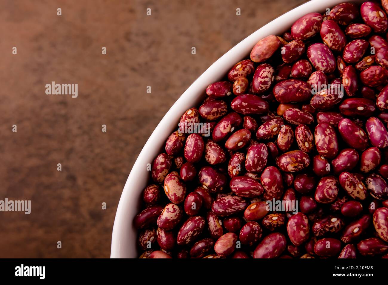 The photo shows red beans. The texture of the seeds is made in high ...