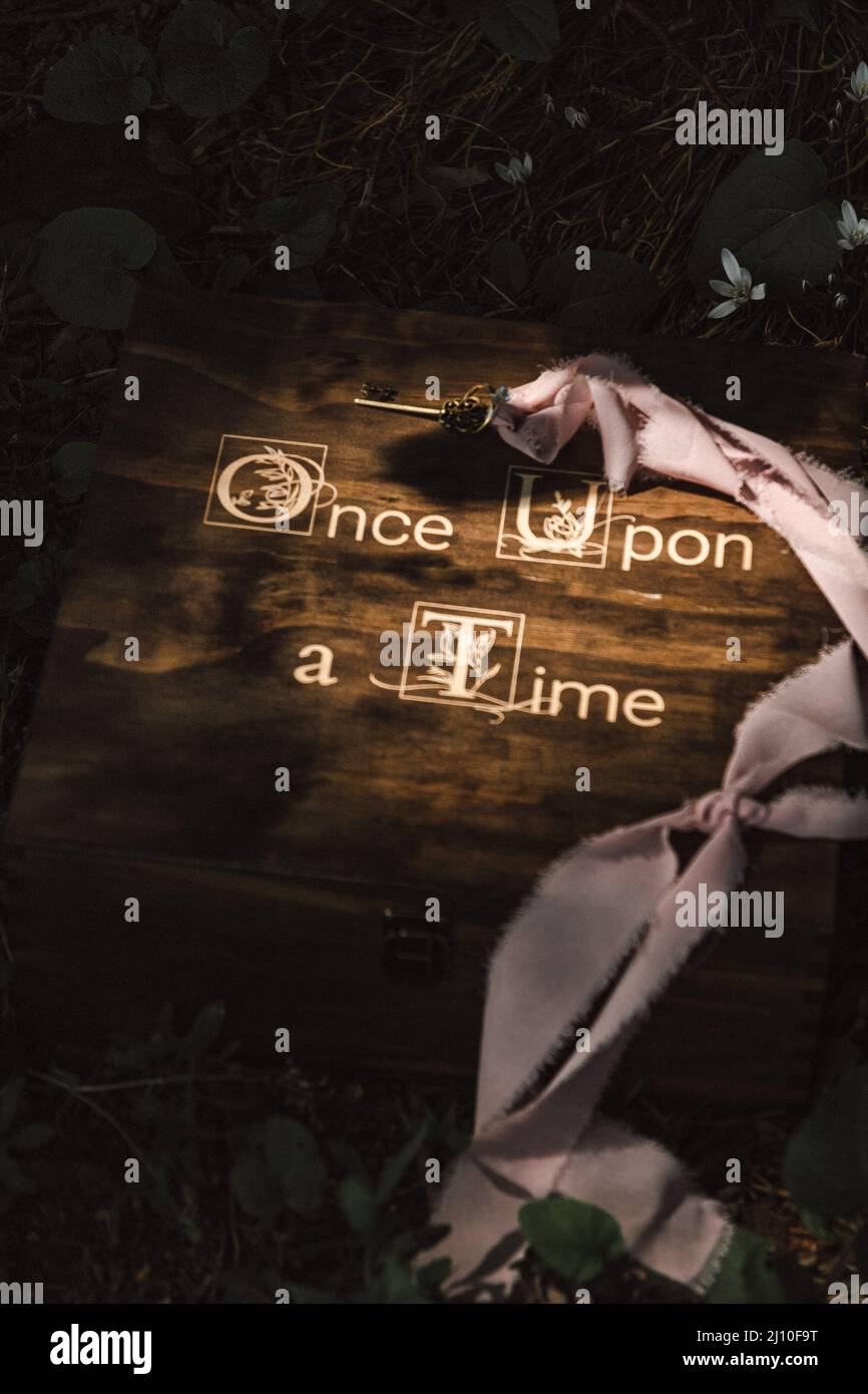 Once upon a time text on wooden background Stock Photo - Alamy