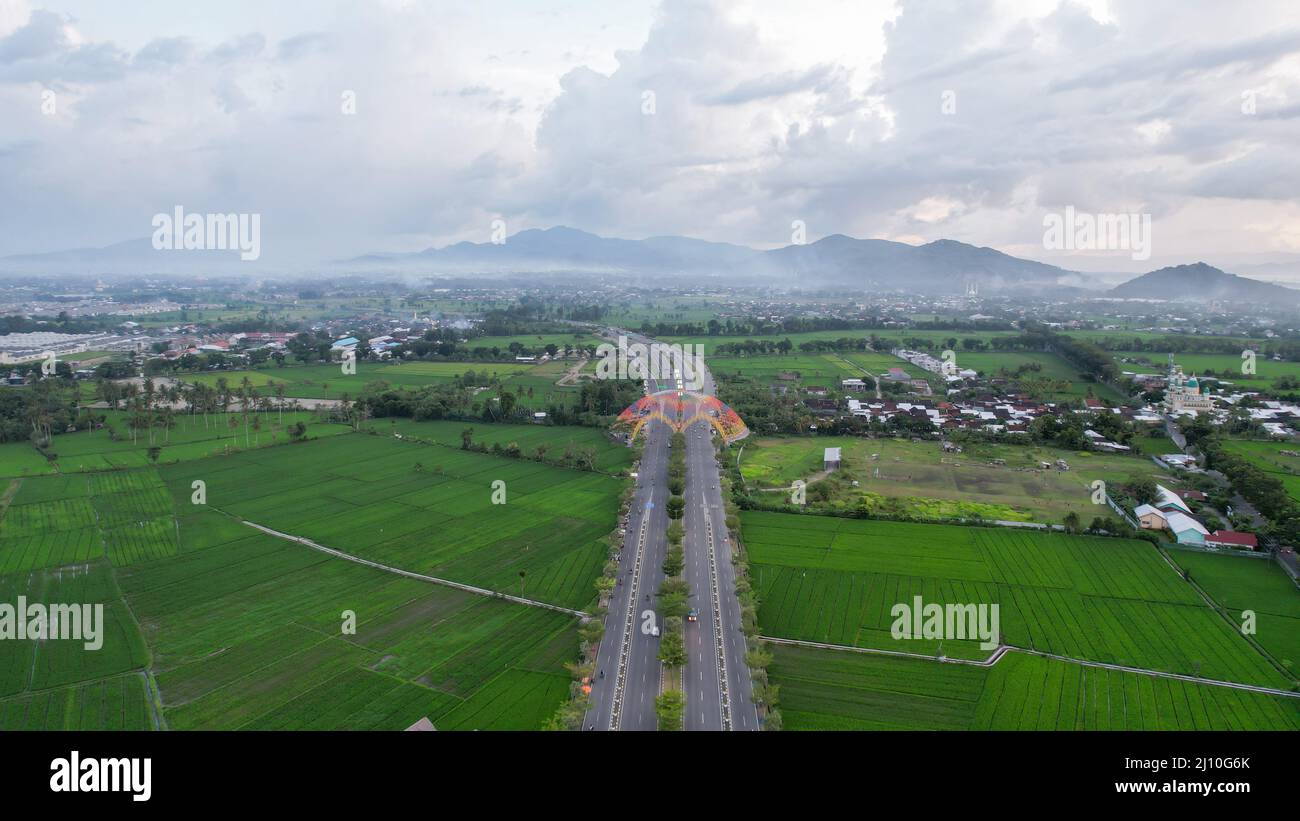 Aerial view of the city colorful Monument Tembolak Rainbow on Mataram ...