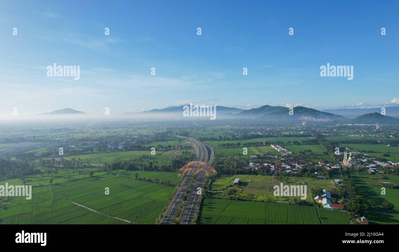 Aerial view of the city colorful Monument Tembolak Rainbow on Mataram ...