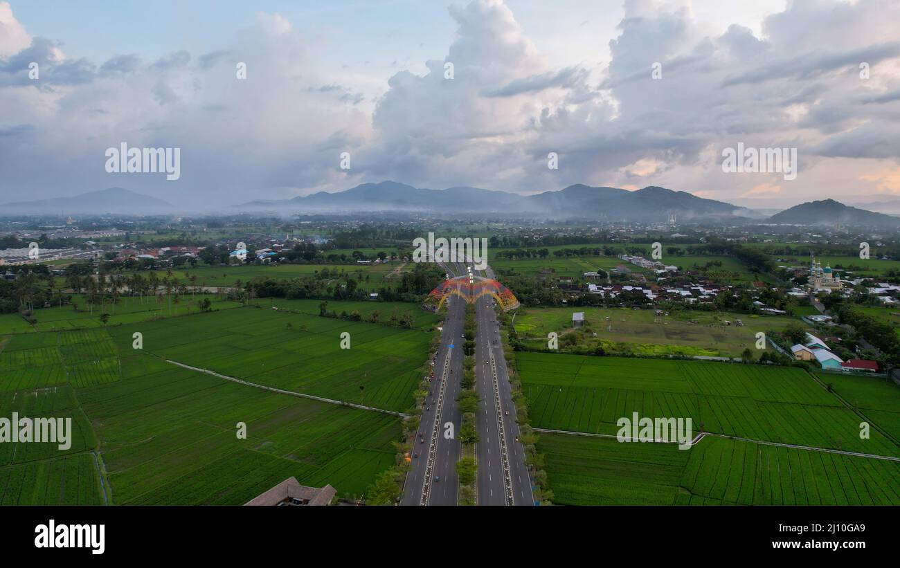 Aerial view of the city colorful Monument Tembolak Rainbow on Mataram ...