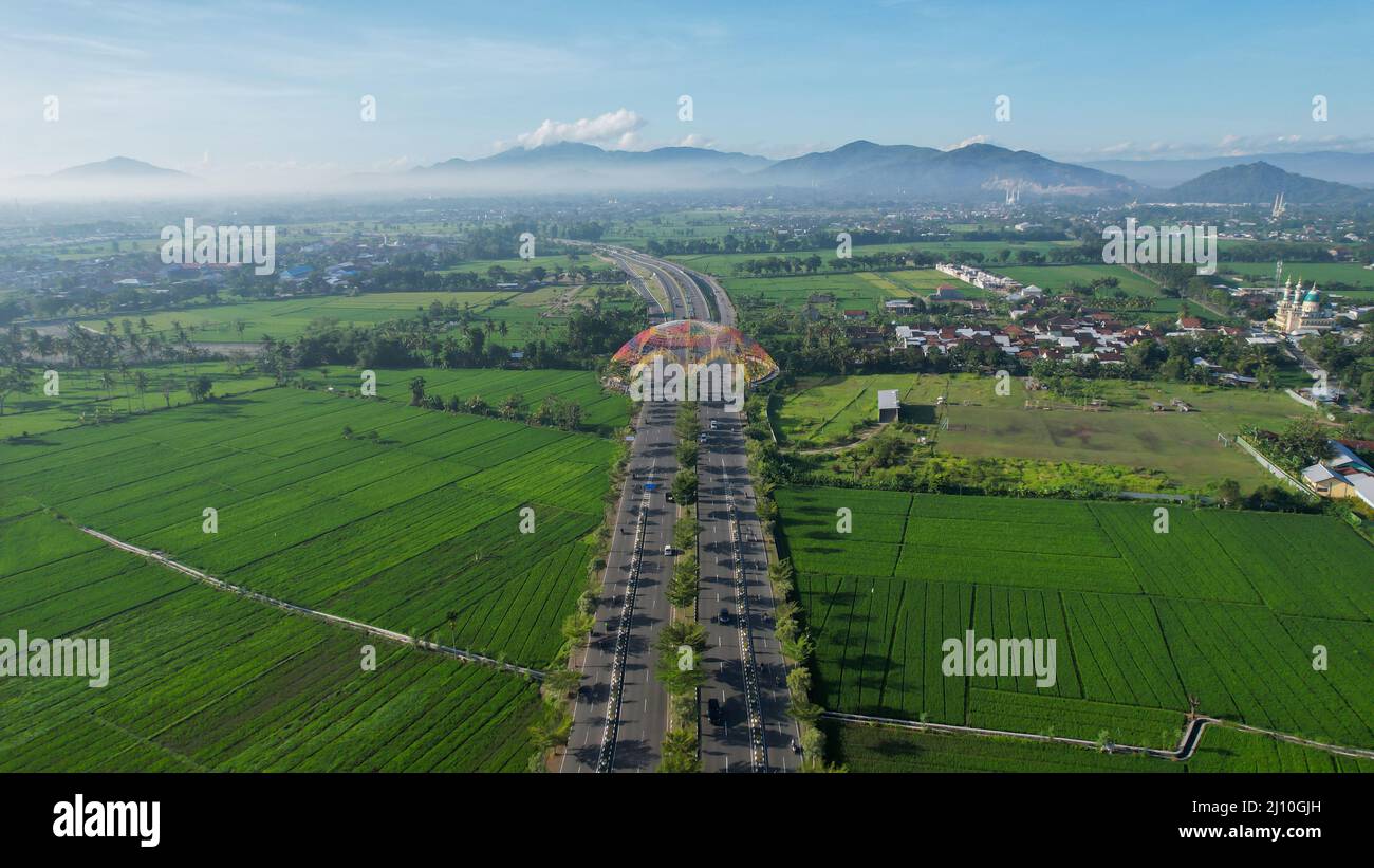 Aerial view of the city colorful Monument Tembolak Rainbow on Mataram ...