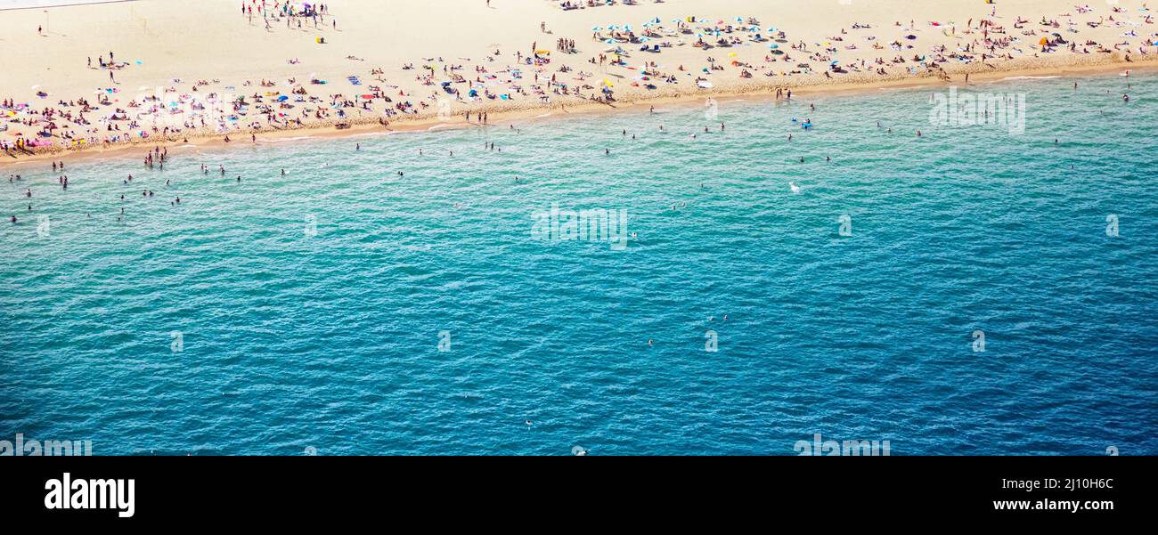 Beach with many people resting at Barcelona seaside Stock Photo - Alamy