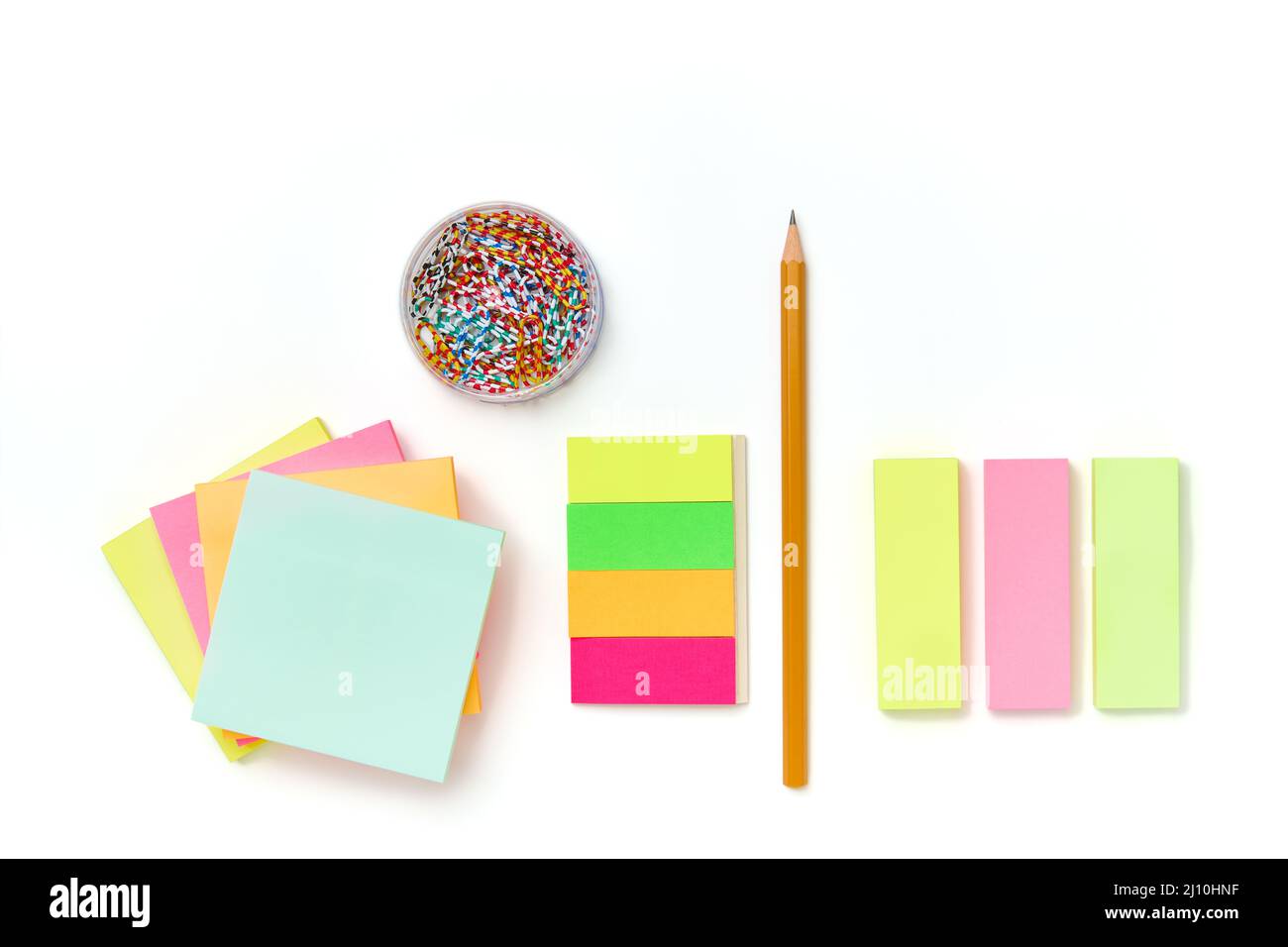 Colorful paper notes, paper clip and pencil on white background Stock ...