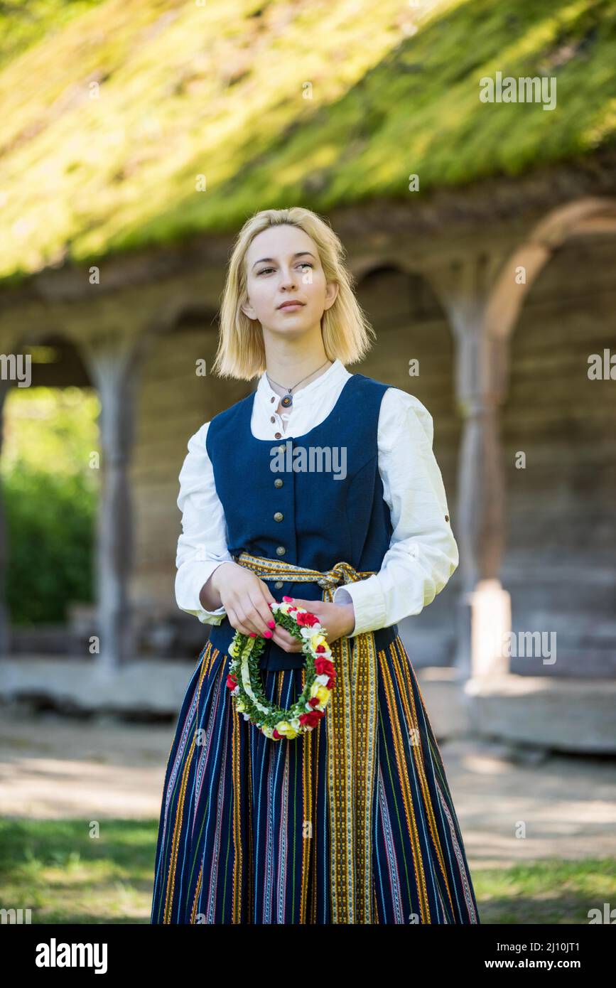 Woman in traditional clothing posing on nature in village Stock Photo ...