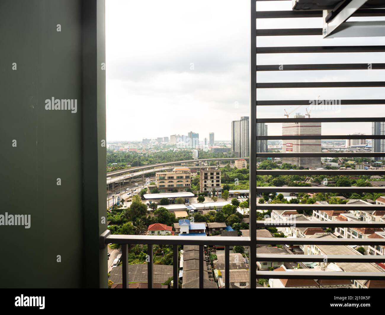 Balcony view and rural scene, fence foreground Stock Photo - Alamy
