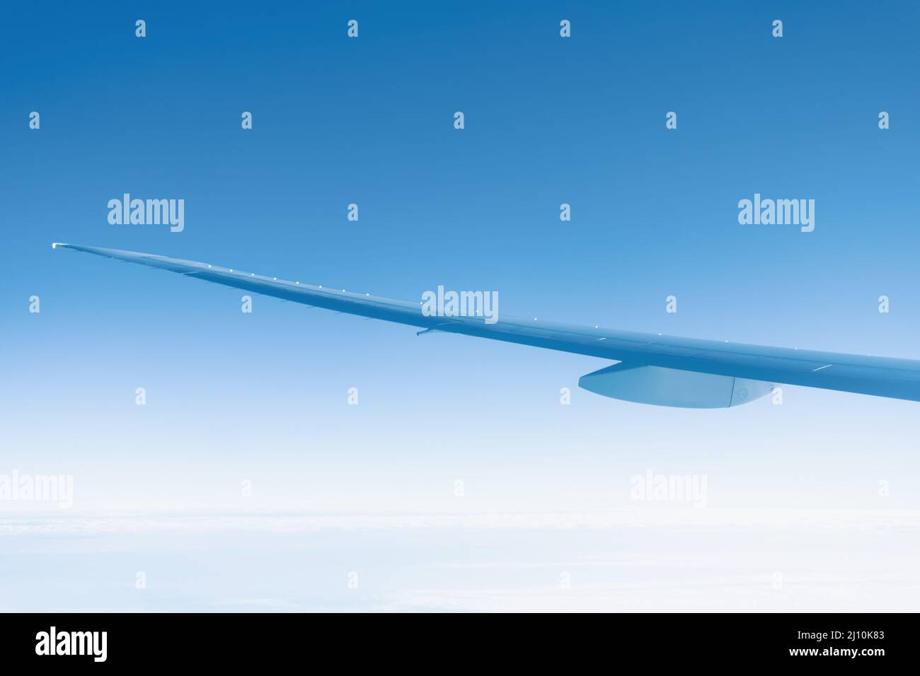 Photo of airplane wing in the sky Stock Photo - Alamy