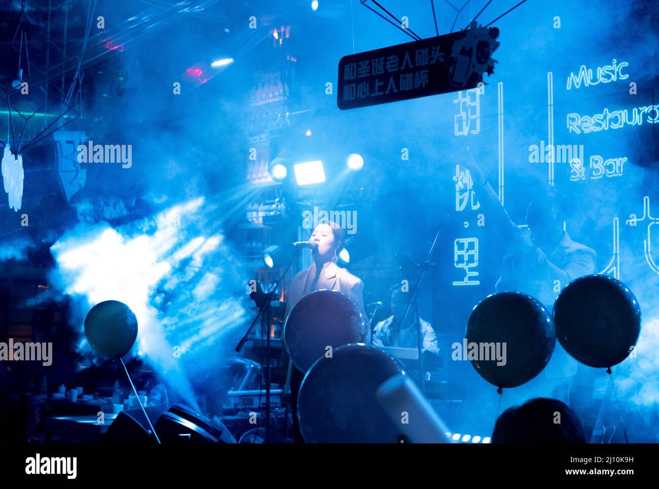 Photo of Chinese singer in a bar Stock Photo - Alamy