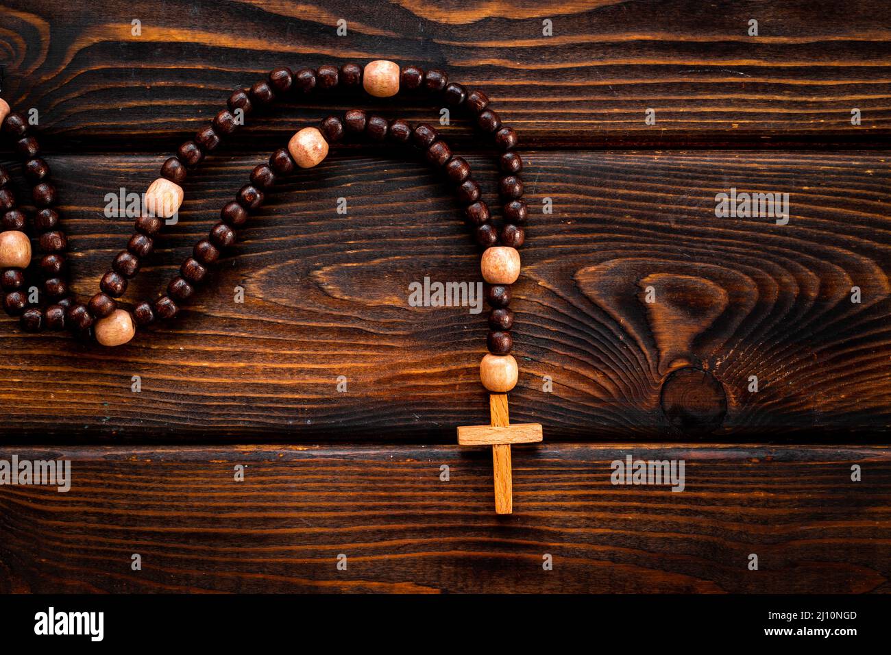 Christian rosary beads with wooden cross. Religion concept Stock Photo ...