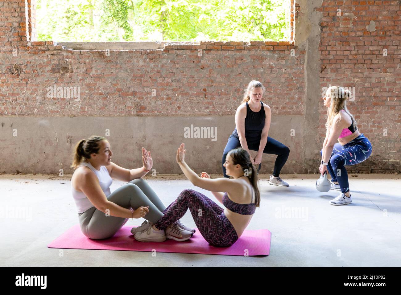 Group of young and attractive sporty caucasian women wearing sports ...