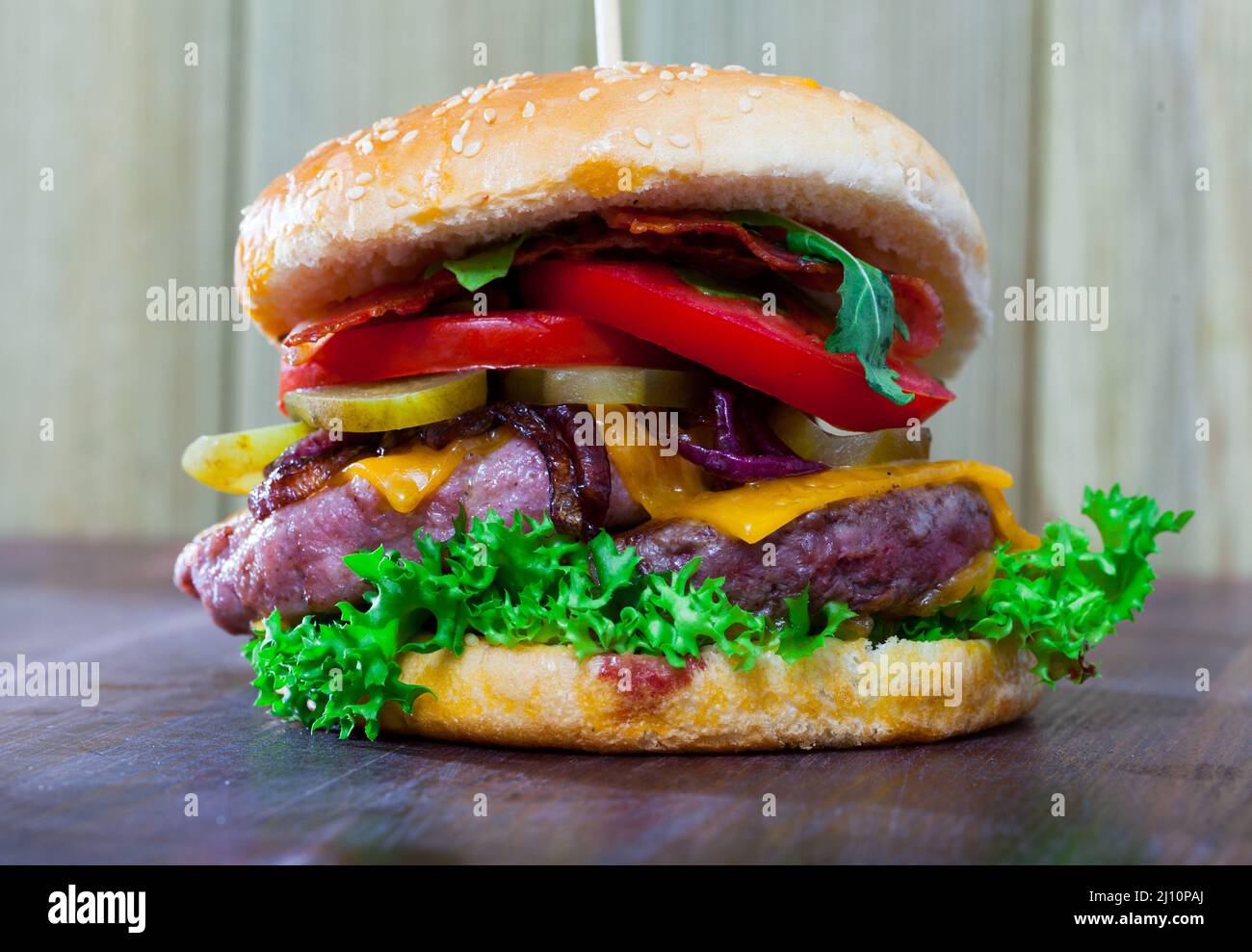Double cheese burger with meat rissole Stock Photo - Alamy