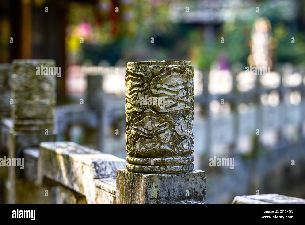 Sculptural stone pillars on the guardrail in a Chinese garden Stock ...
