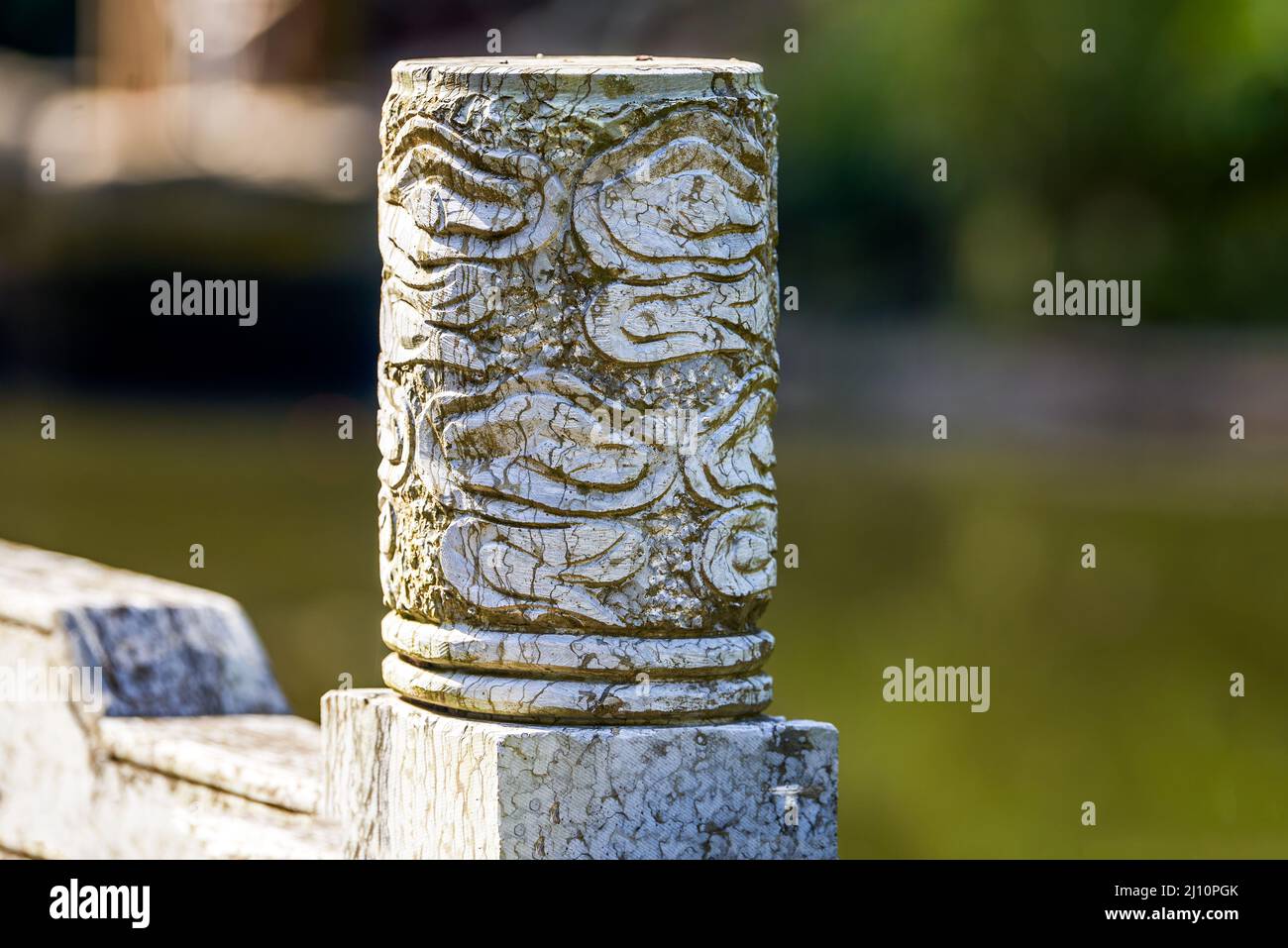 Sculptural stone pillars on the guardrail in a Chinese garden Stock ...