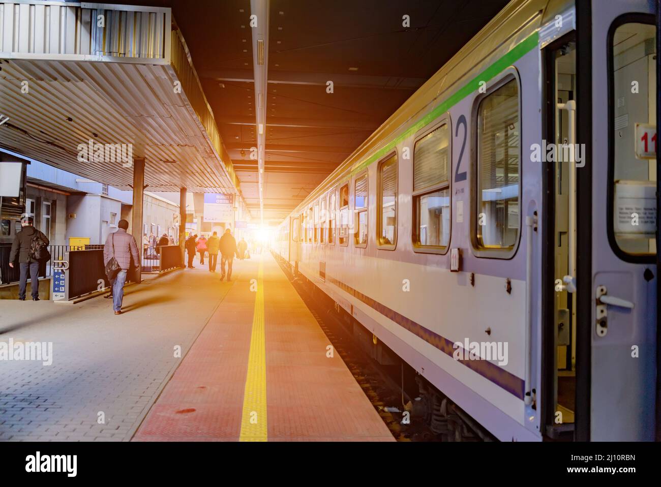 Passenger train on the station platform Stock Photo - Alamy