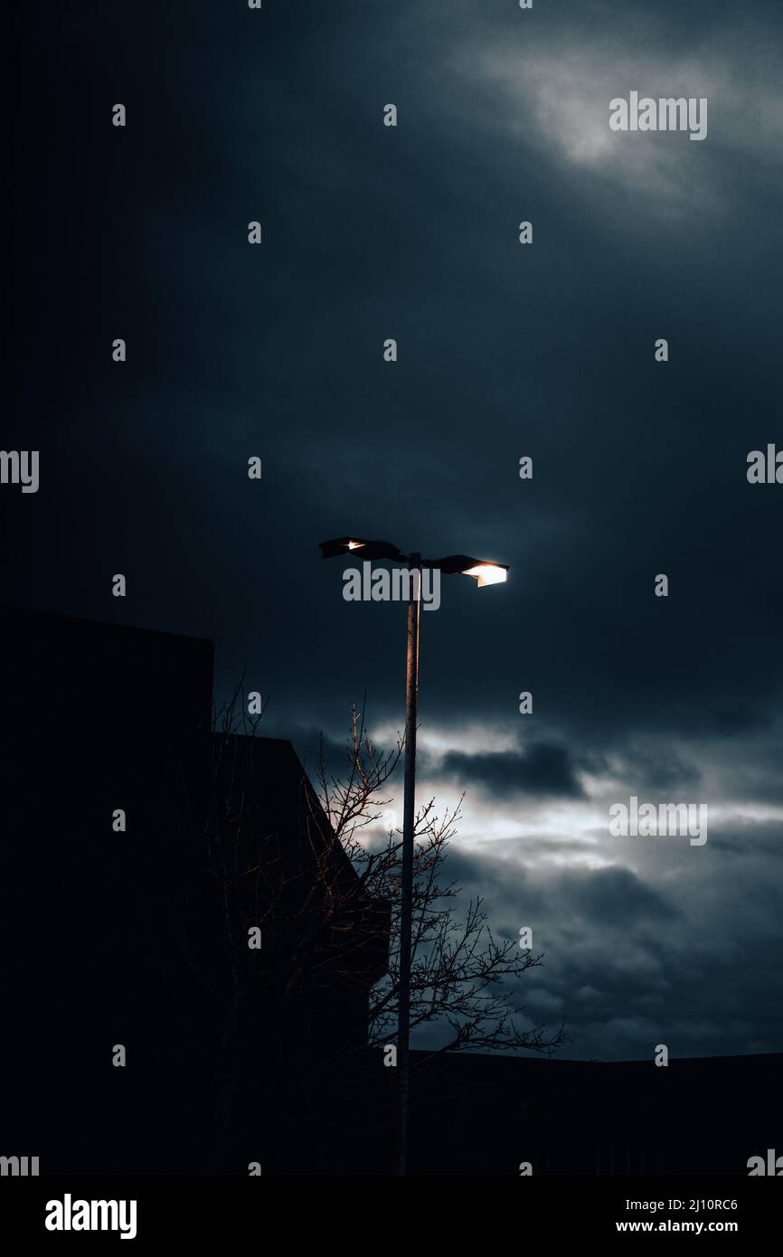Vertical shot of a street light at night Stock Photo - Alamy